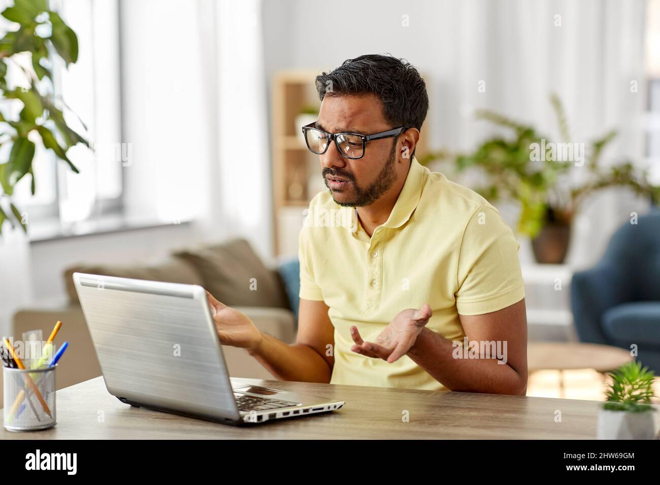 sad man with laptop working at home office Stock Photo - Alamy