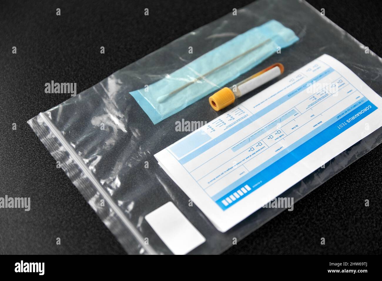 beaker with test, cotton swab and medical report Stock Photo - Alamy