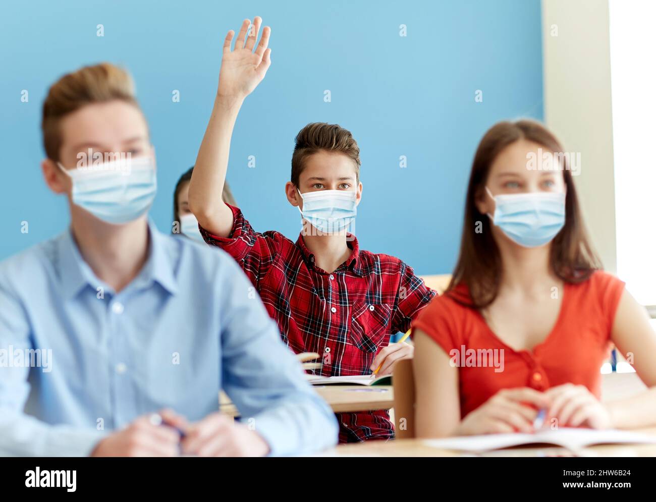 group of students in masks at school lesson Stock Photo - Alamy