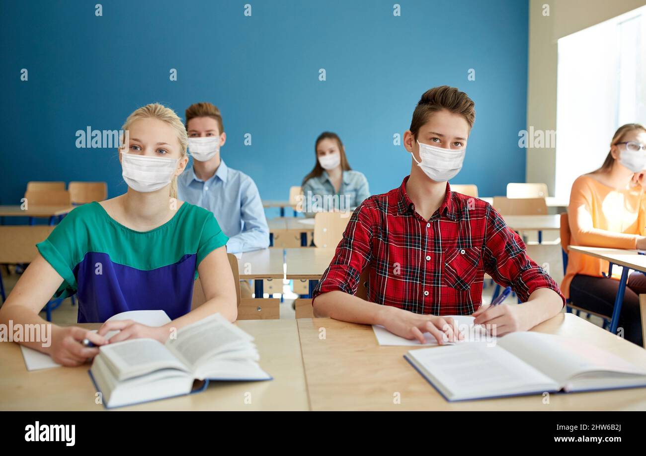 group of students in masks at school lesson Stock Photo - Alamy