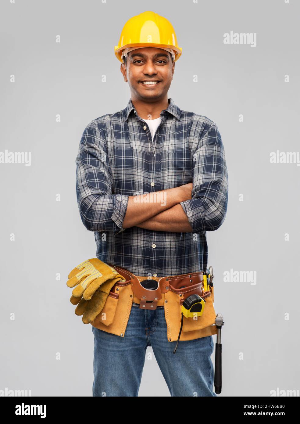 happy indian worker or builder with crossed arms Stock Photo - Alamy