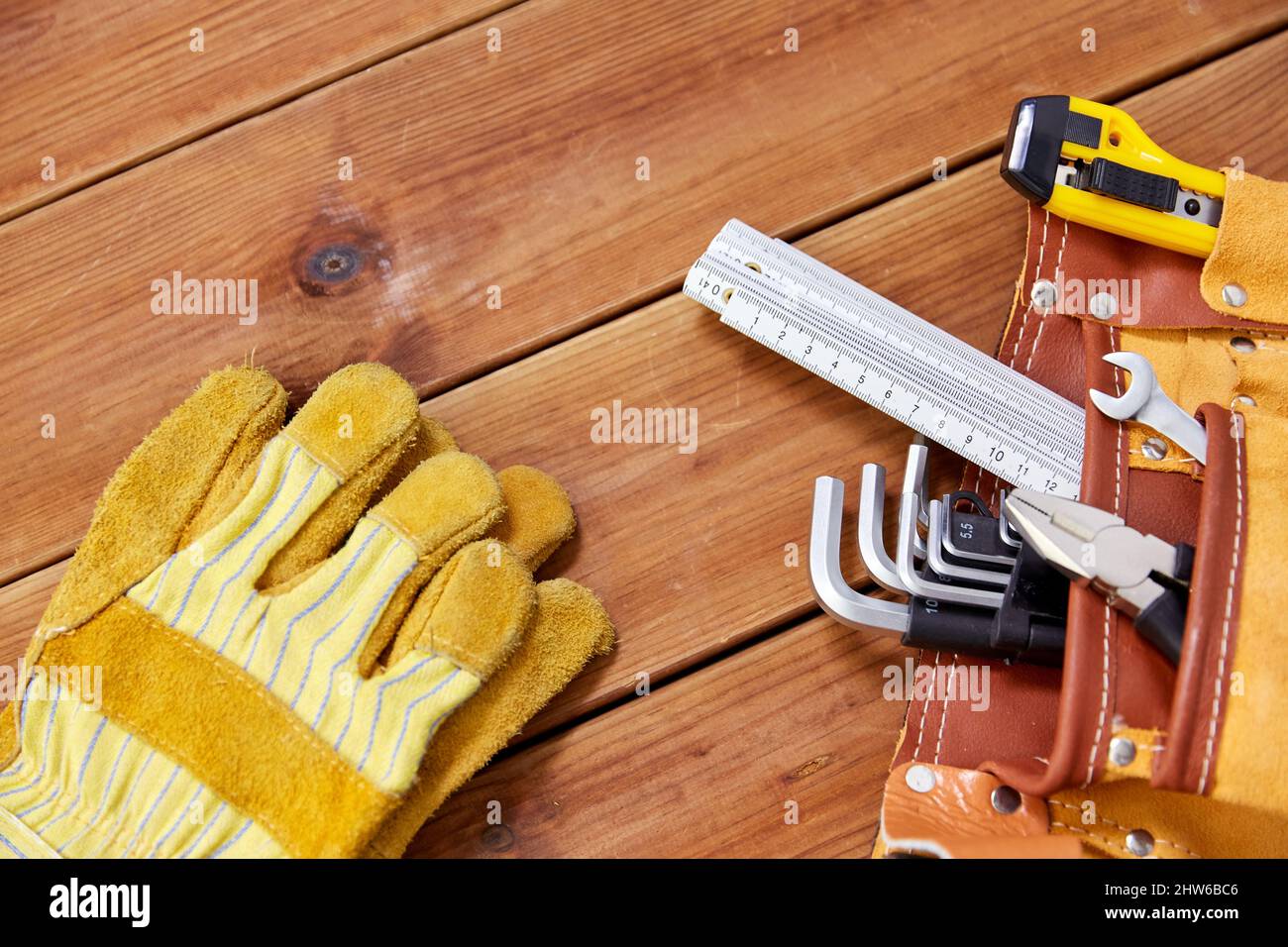 different work tools in belt on wooden boards Stock Photo - Alamy