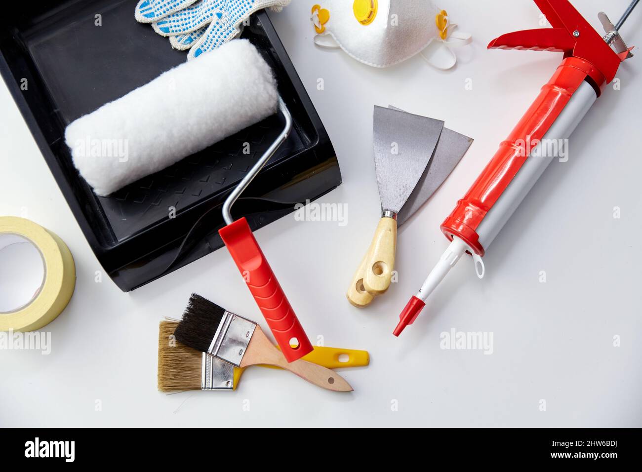 different painting work tools on white background Stock Photo - Alamy