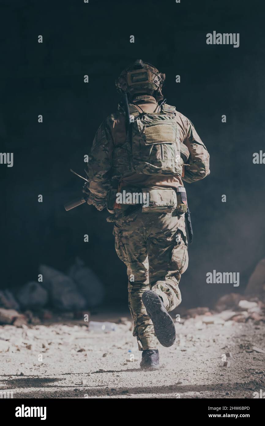 A bearded soldier in uniform of special forces in a dangerous military ...