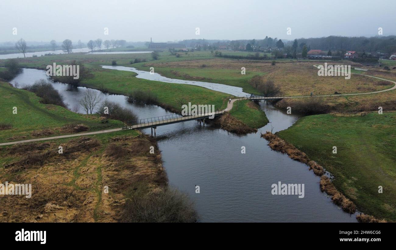 Aerial view of a river with small bridge Stock Photo - Alamy