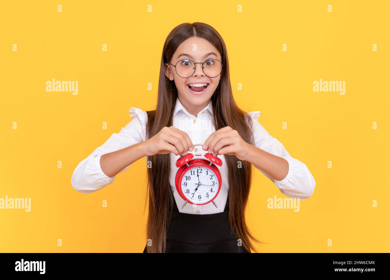 school kid in uniform and glasses showing time. you are late. deadline ...