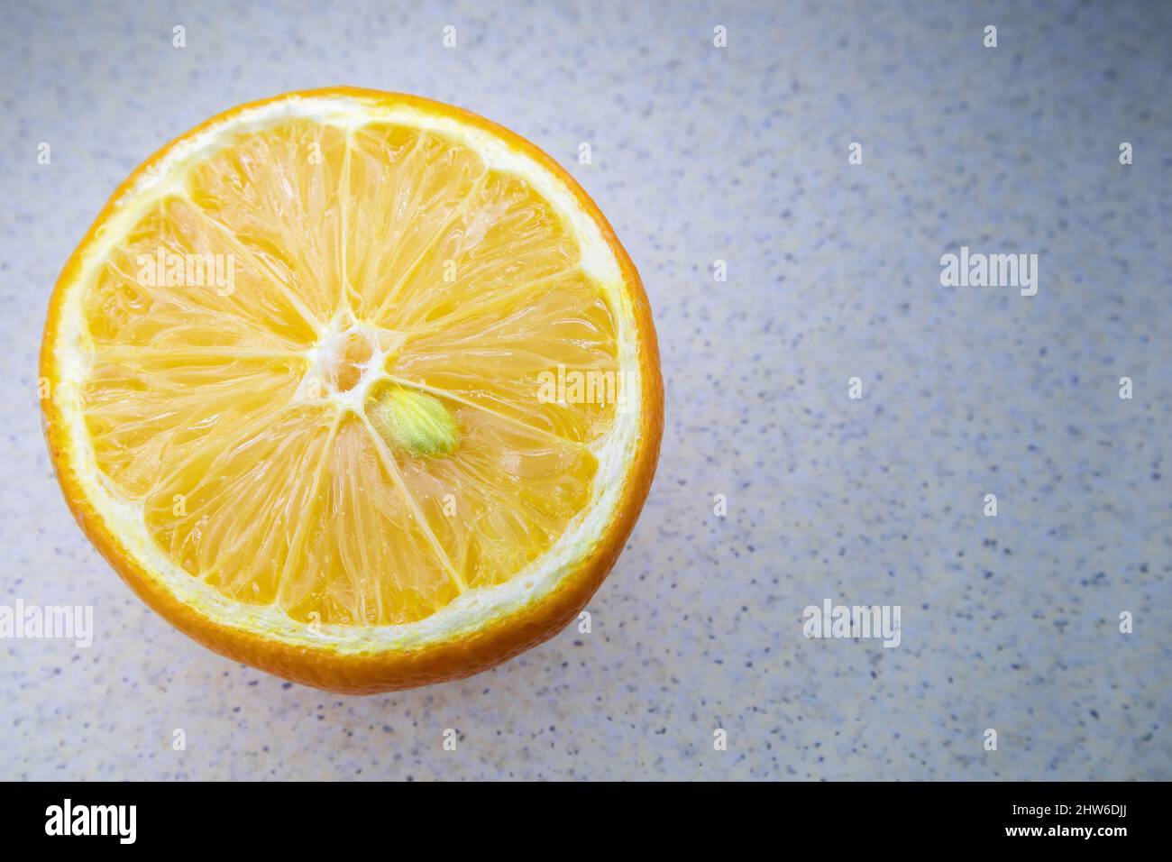 Half of a lemon on kitchen desk Stock Photo - Alamy