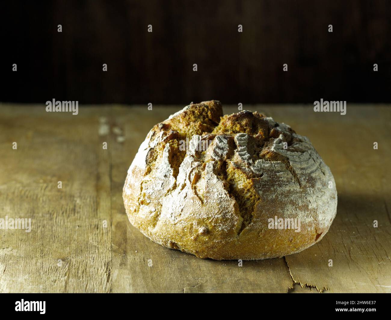 Rye bread on a wooden table isolated on the black background Stock ...