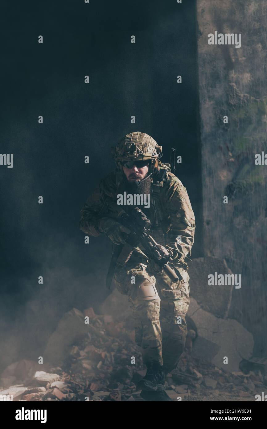 A bearded soldier in uniform of special forces in a dangerous military ...