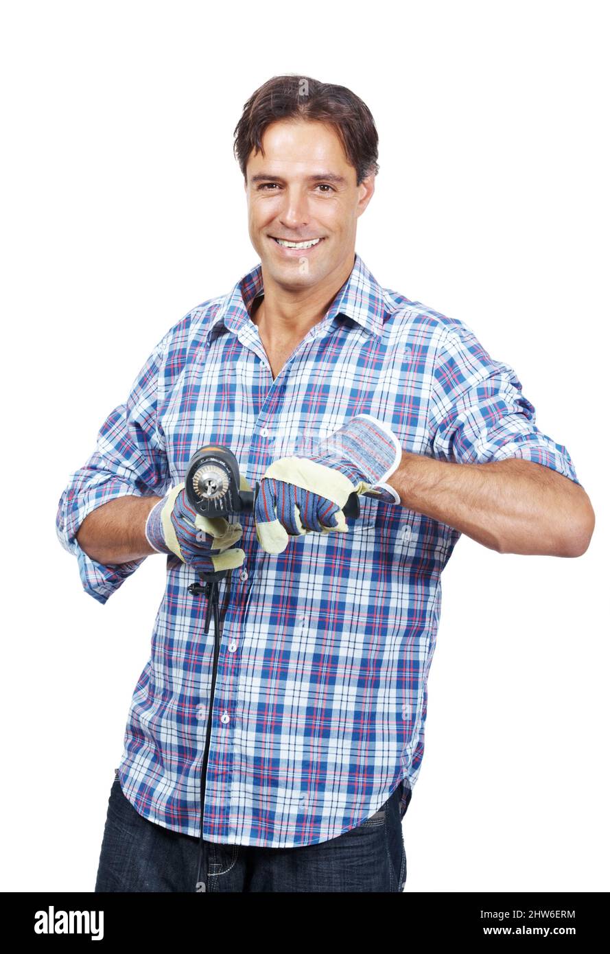 Happy craftsman holding a drill machine in hand isolated on white ...