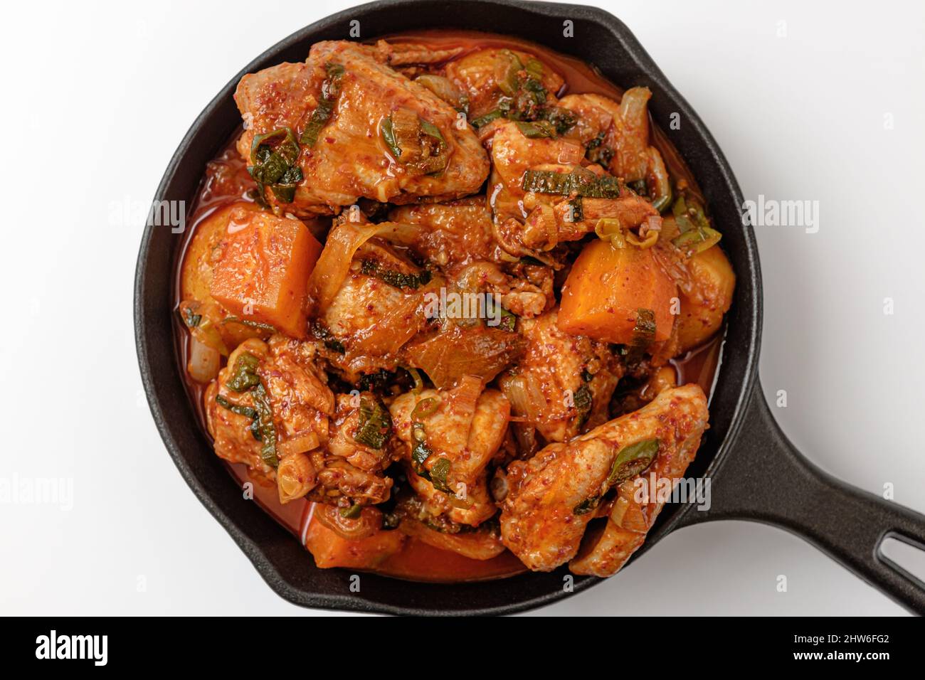 Braised Spicy Chicken on a white background Stock Photo - Alamy