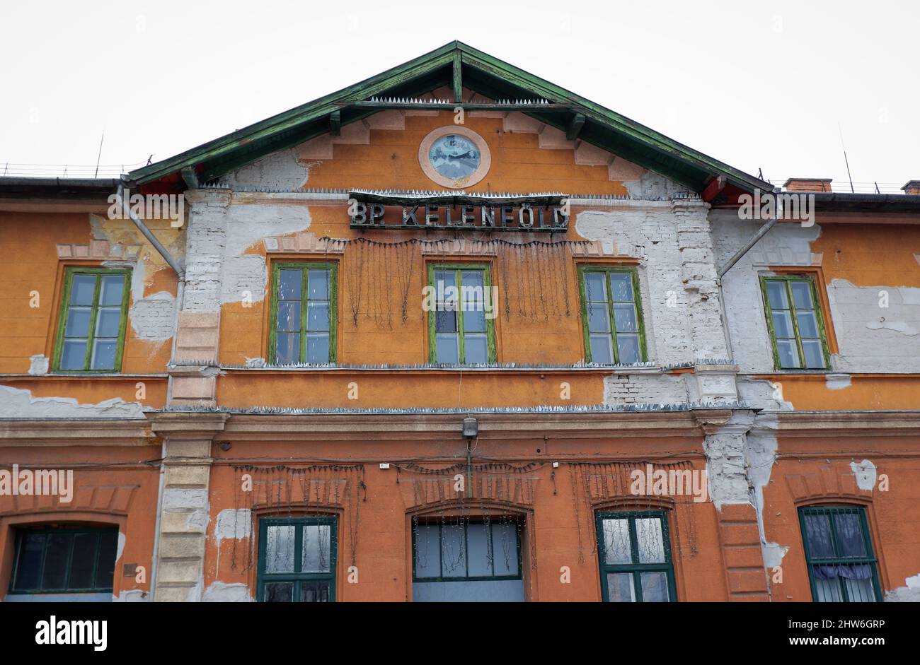 Facade of an abandoned old weathered railway train station building in ...