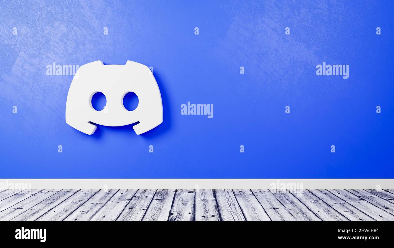 Discord Logo on Wooden Floor Against Wall Stock Photo - Alamy