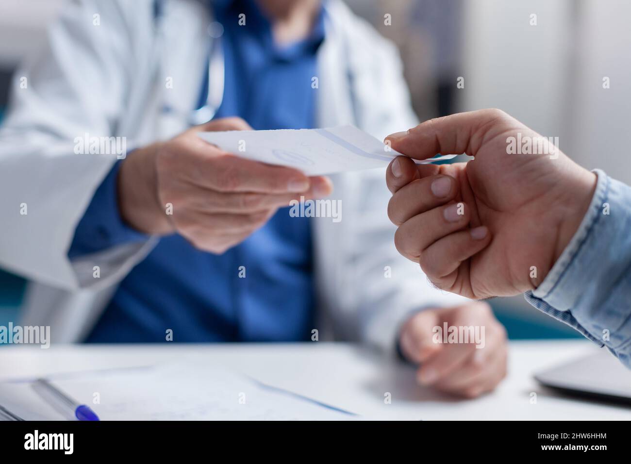Handing papers hospital hi-res stock photography and images - Alamy