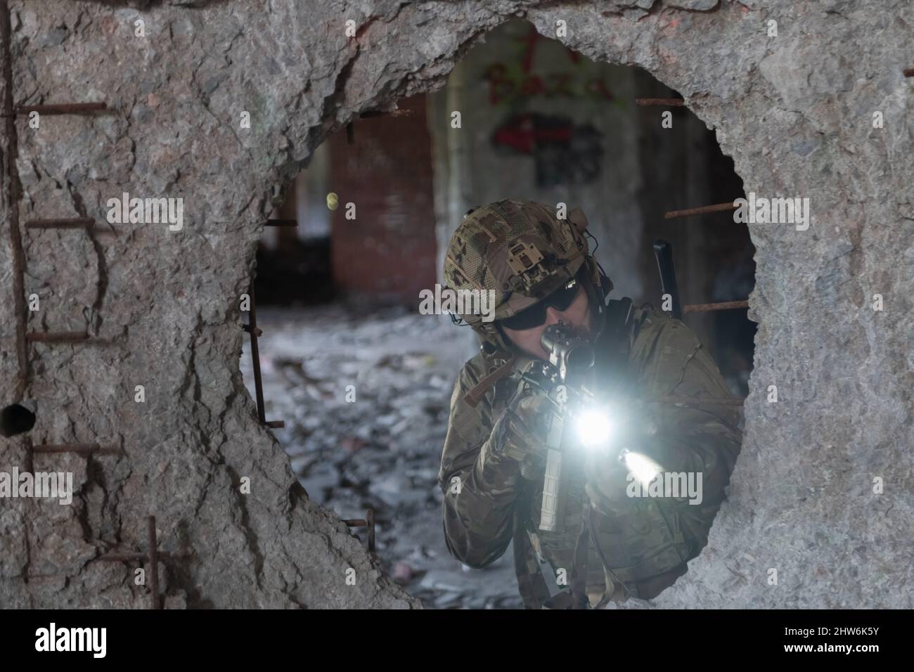 A bearded soldier in uniform of special forces in a dangerous military ...
