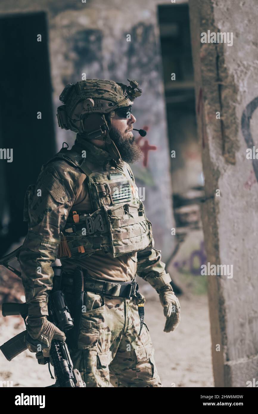 A bearded soldier in uniform of special forces in a dangerous military ...