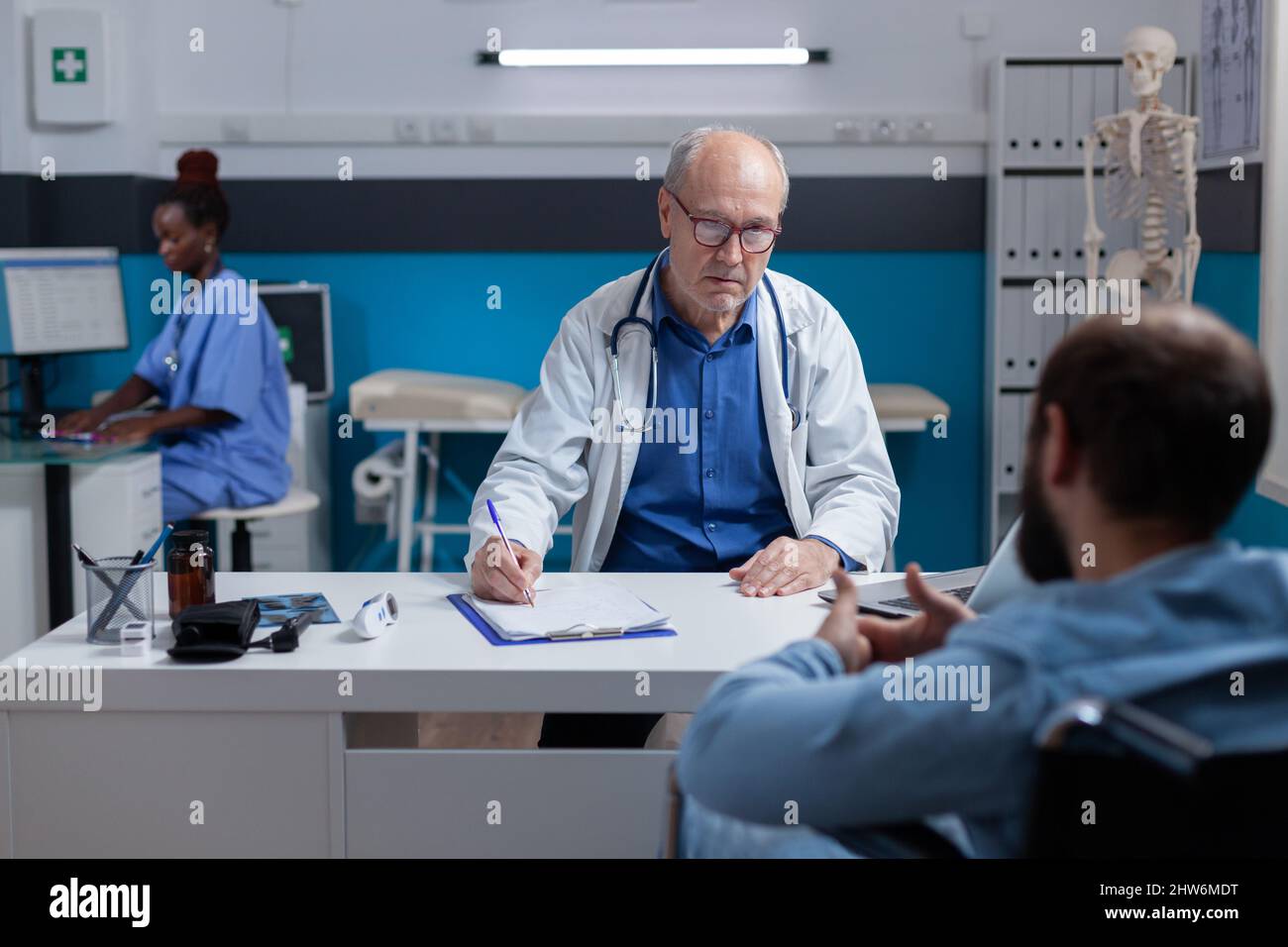 Young man with disability having medical consultation with doctor for ...