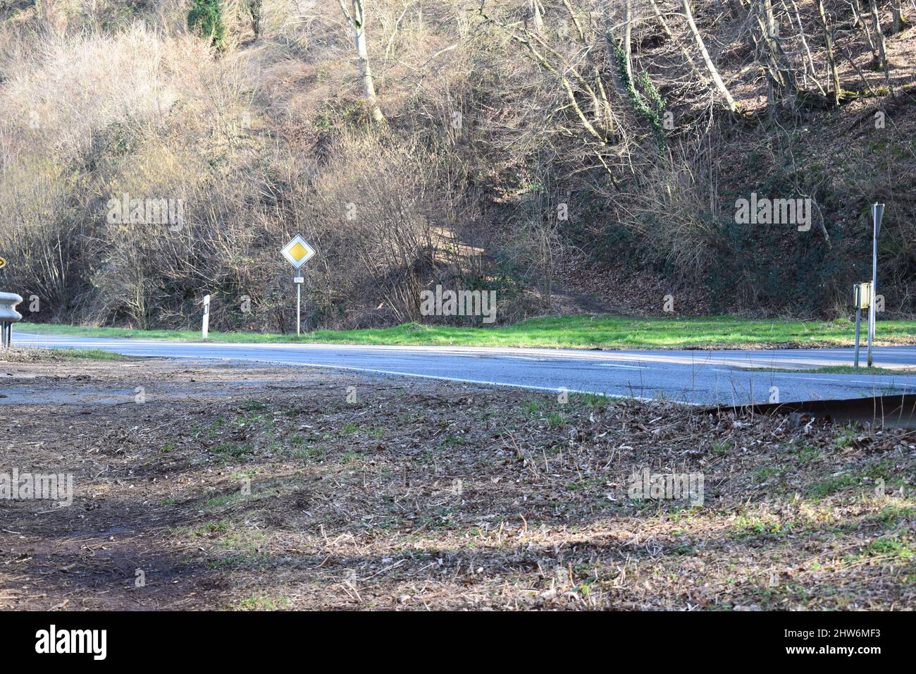 road through a narrow valley in the Eifel, with an intersection to the ...