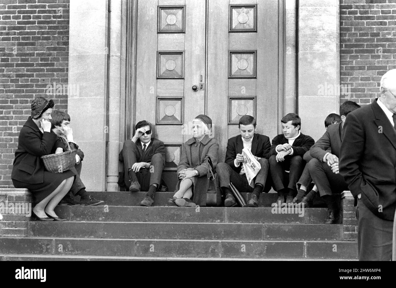 Members of the public waiting to go into court to see Mick Jagger and ...