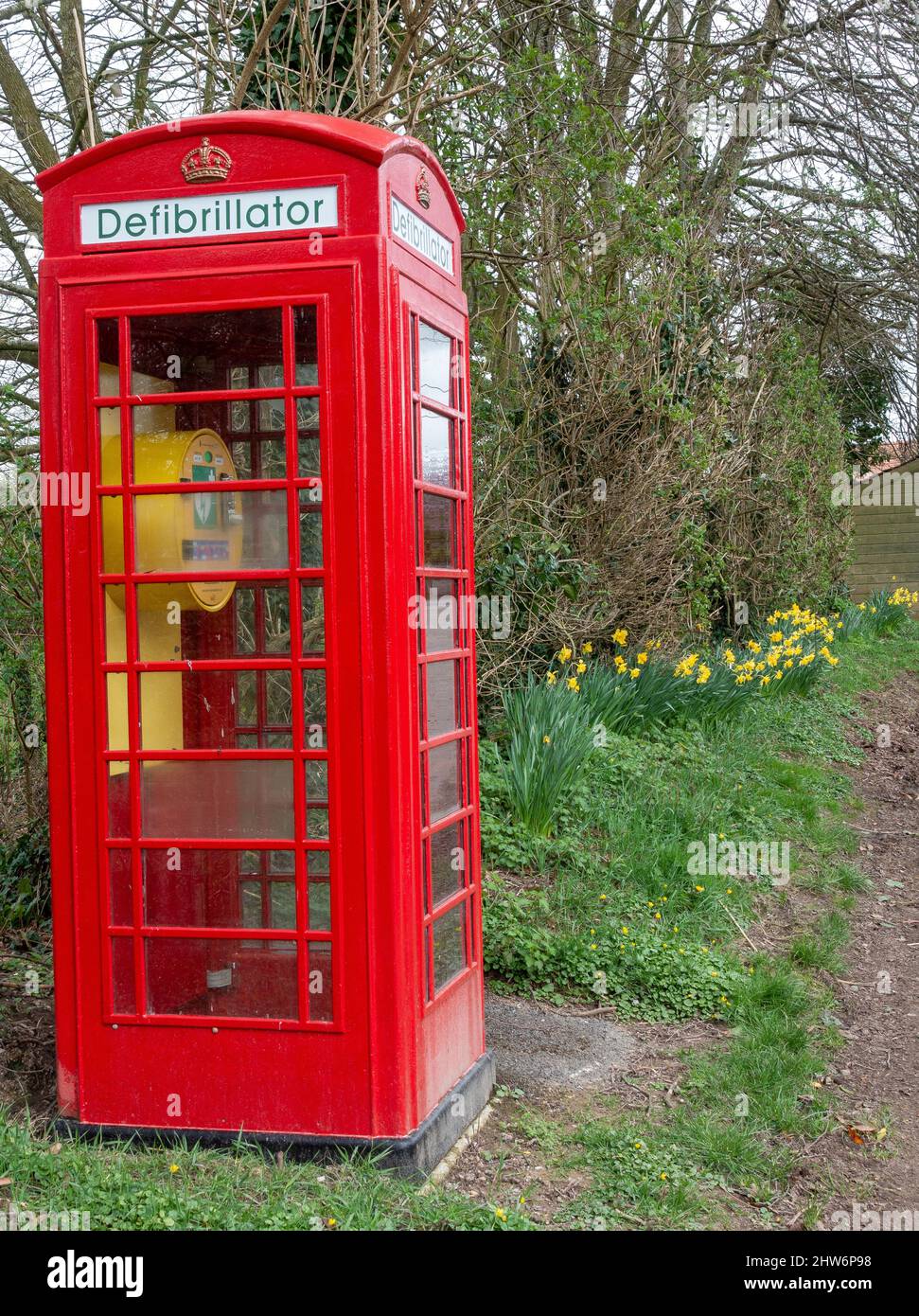 Red phone box converted to housing a defibrillator Stock Photo - Alamy