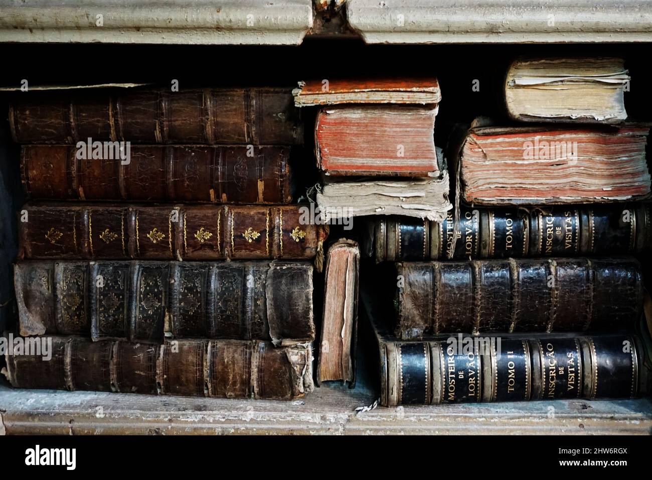 Old antique books in a library Stock Photo - Alamy