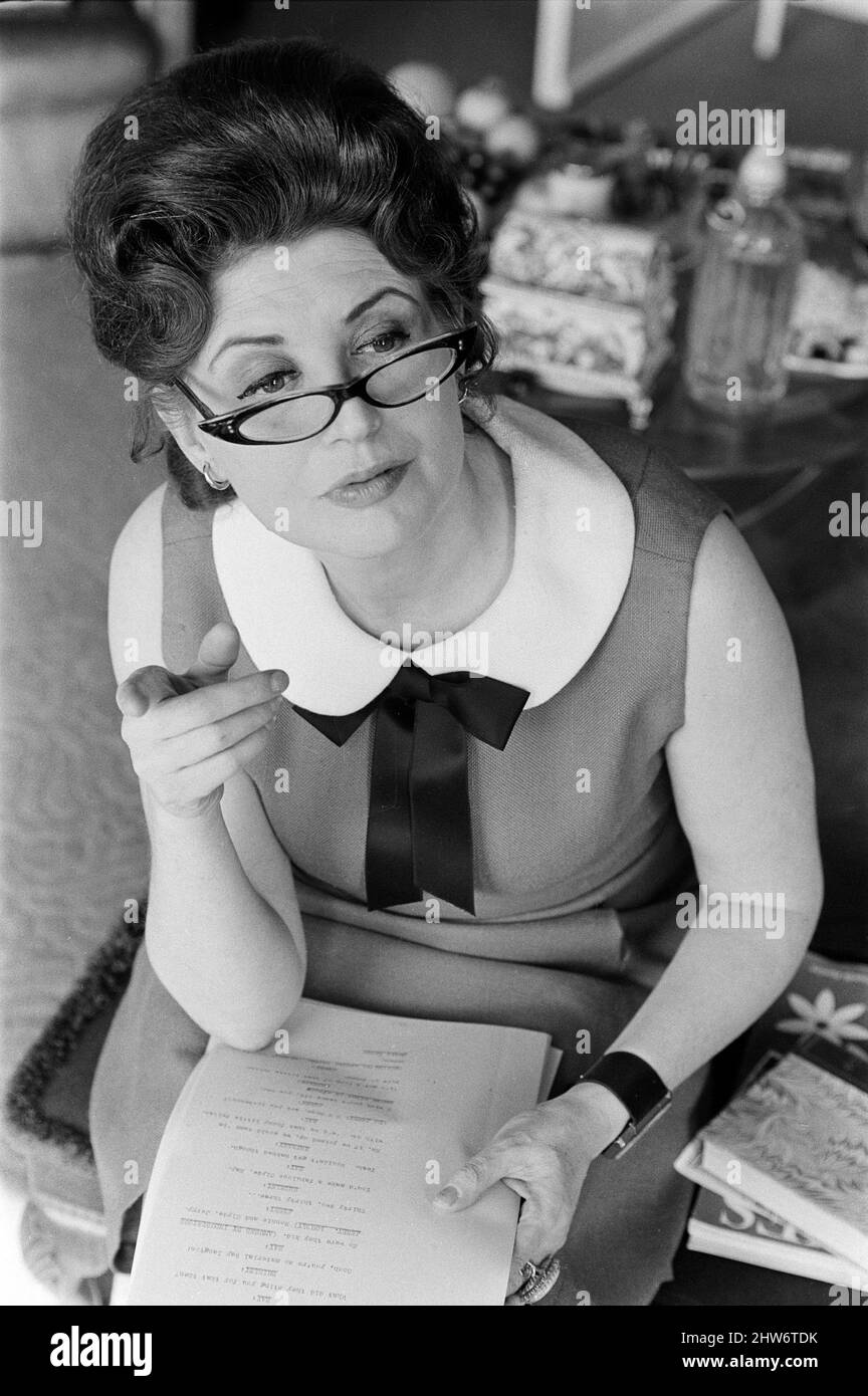Pat Phoenix at home, reading her script. 16th April 1968 Stock Photo ...