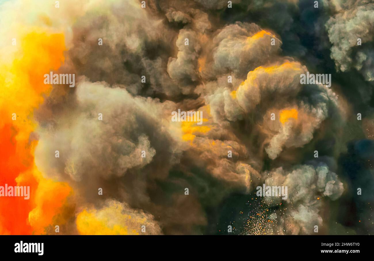 Close up of dust storm and fire of dynamite blast on the construction ...