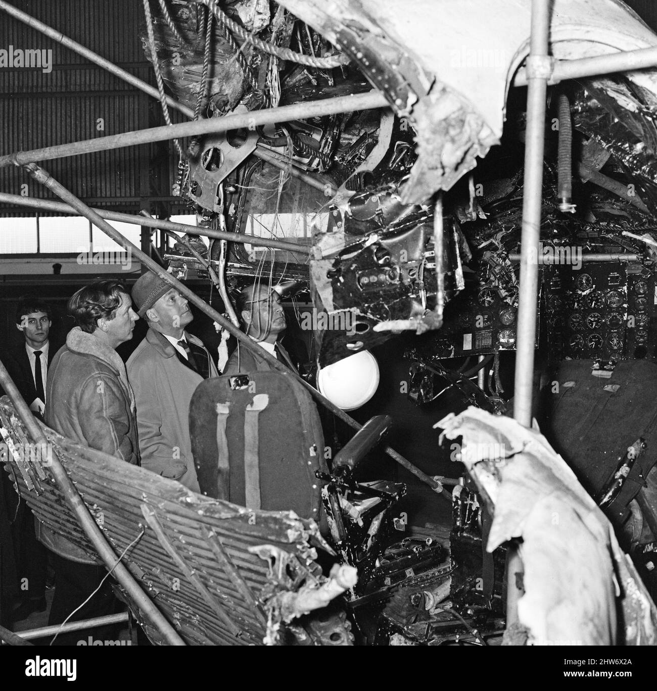 Captain Harry Marlow,(left in woollen collar) inspects the wreckage of ...