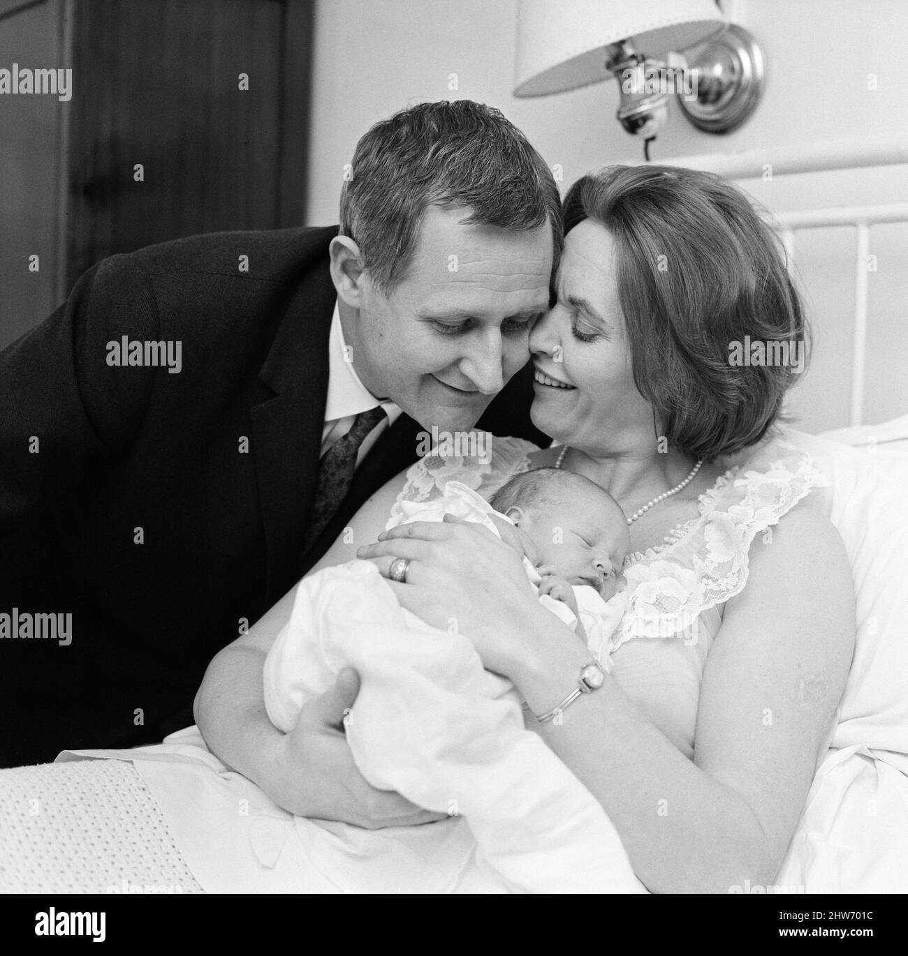 Holding her 12-hour old baby is stage and TV actress Lillias Walker ...