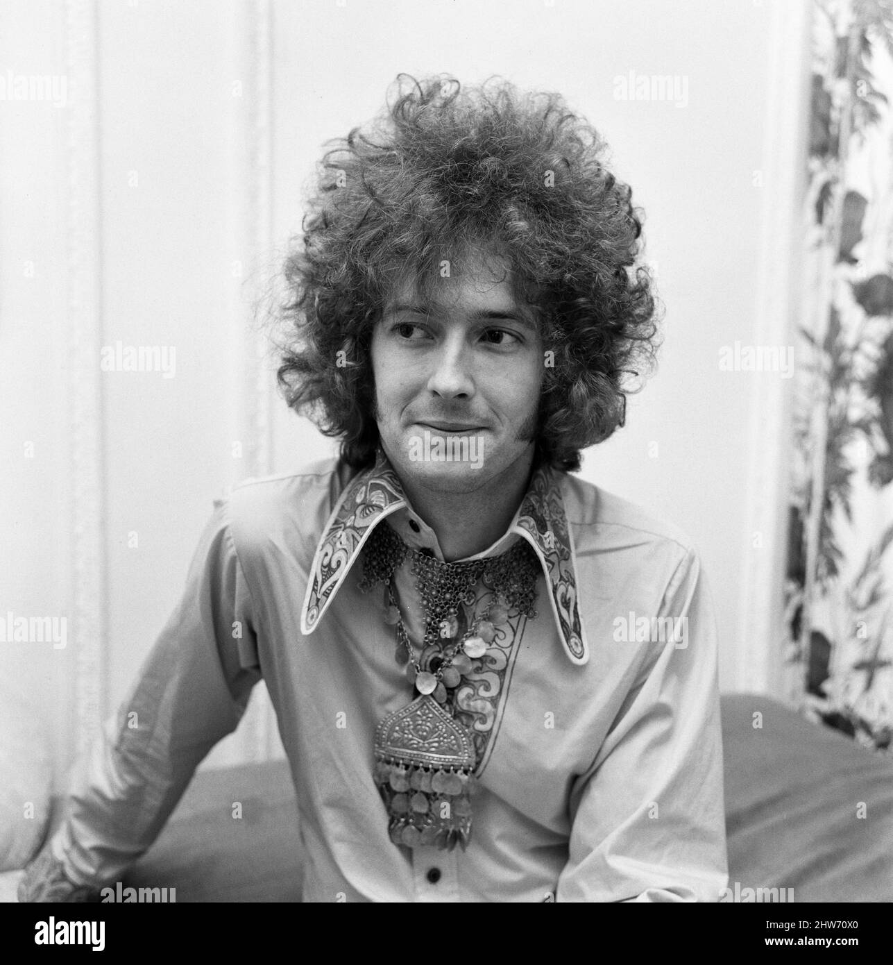 Eric Clapton of Cream shows off his curly hair that is created for him ...