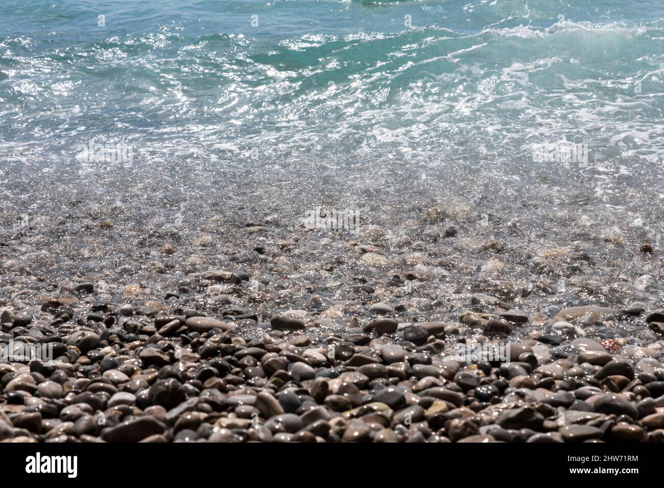 Rocky beach and pebble stones at sea Stock Photo - Alamy