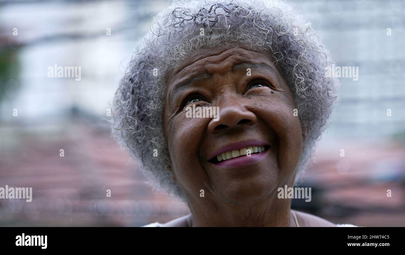 An African senior woman looking at sky with HOPE and FAITH Stock Photo ...