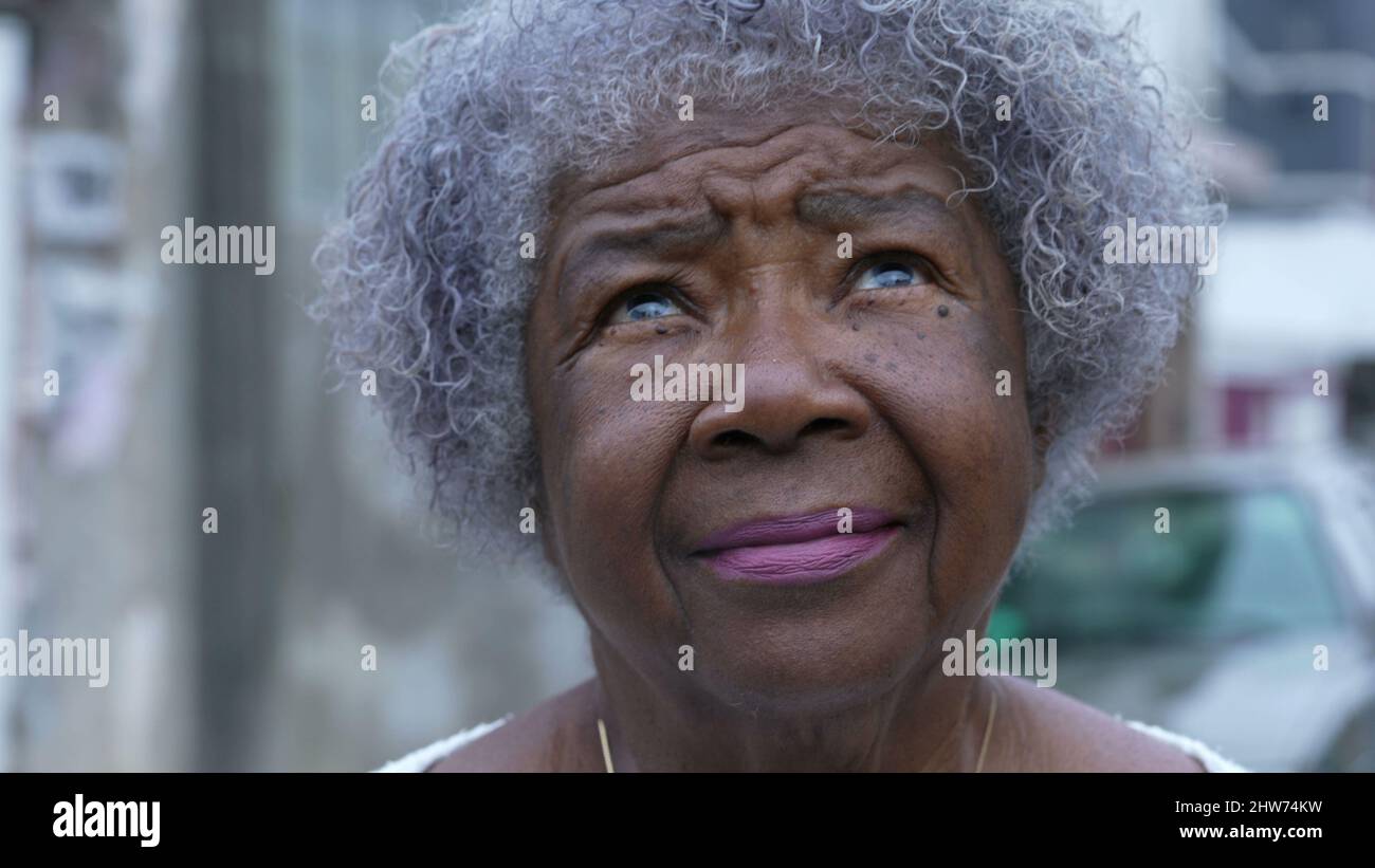 An older senior person looking up to sky with HOPE and FAITH Stock ...