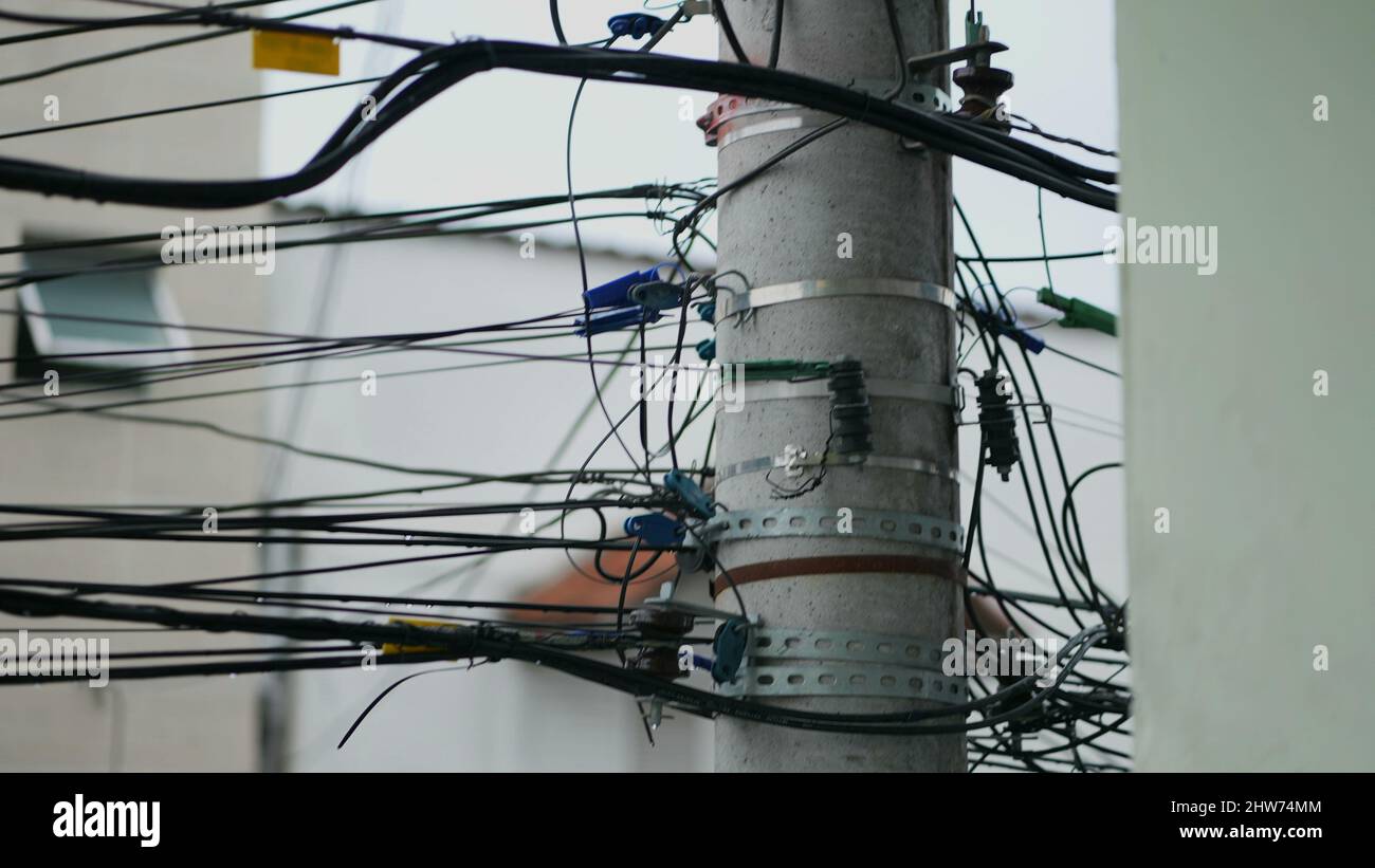Electric pole with wires in third world country Stock Photo - Alamy