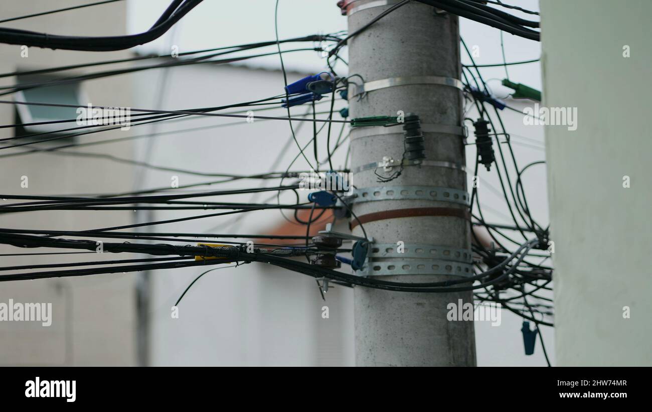 Electric pole with wires in third world country Stock Photo - Alamy