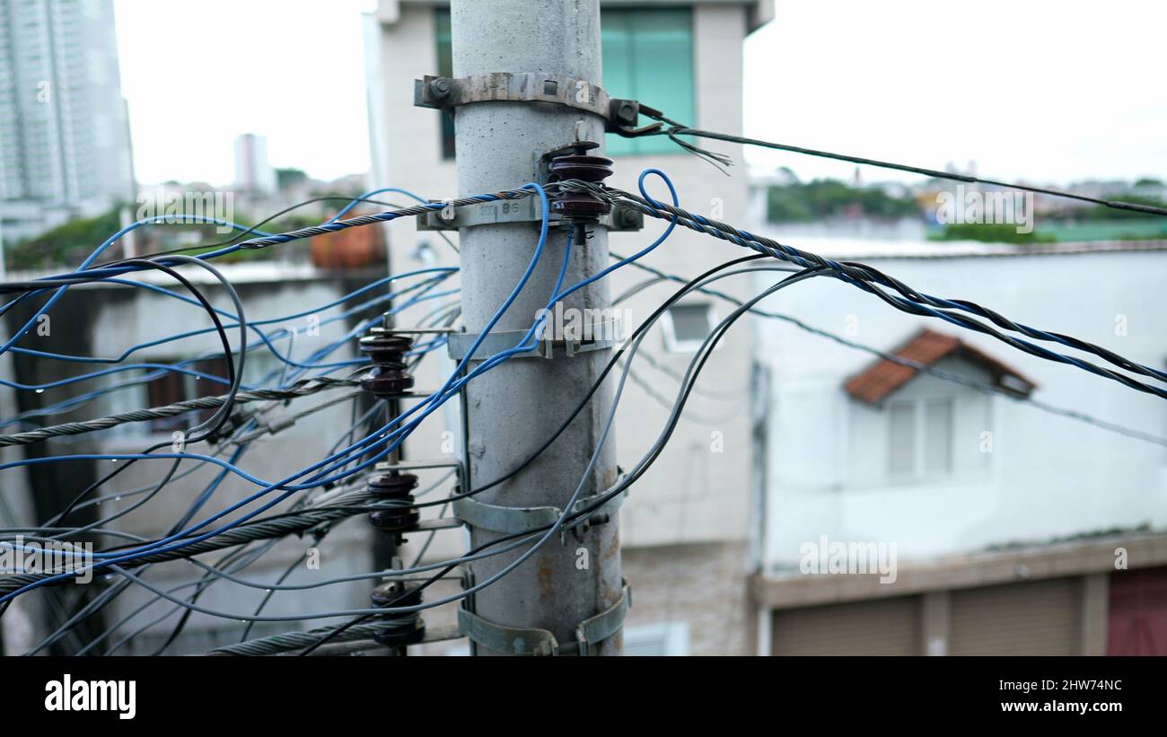 Electric pole with wires in third world country Stock Photo - Alamy