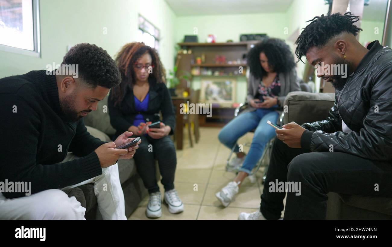 Group of people staring at cellphone devices Family looking at phones ...