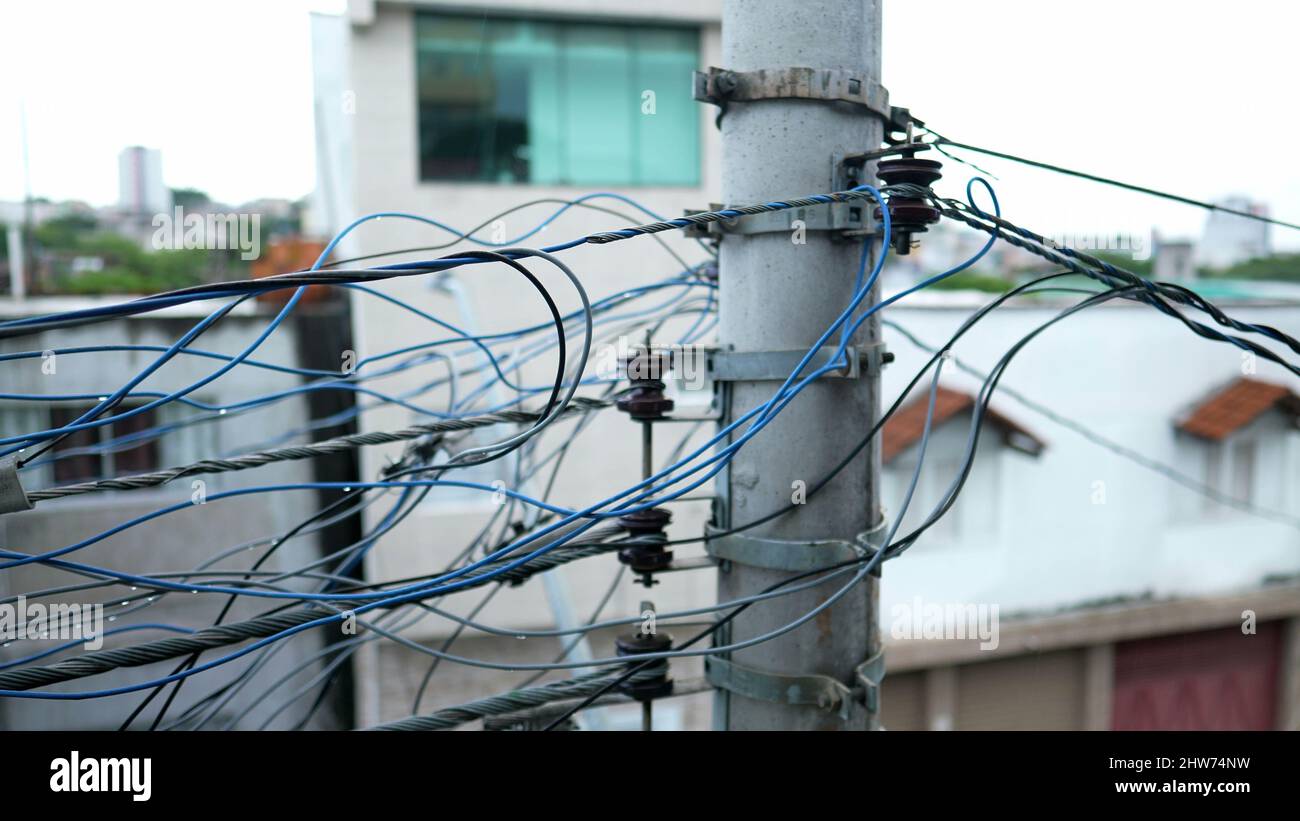 messy electric electric wires connected on pole Stock Photo - Alamy