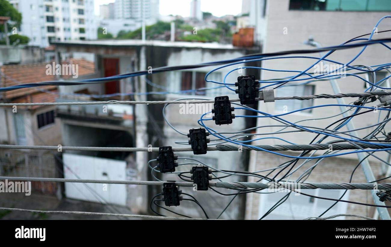 messy electric electric wires connected on pole Stock Photo - Alamy