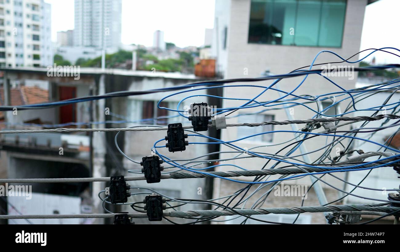 messy electric electric wires connected on pole Stock Photo - Alamy