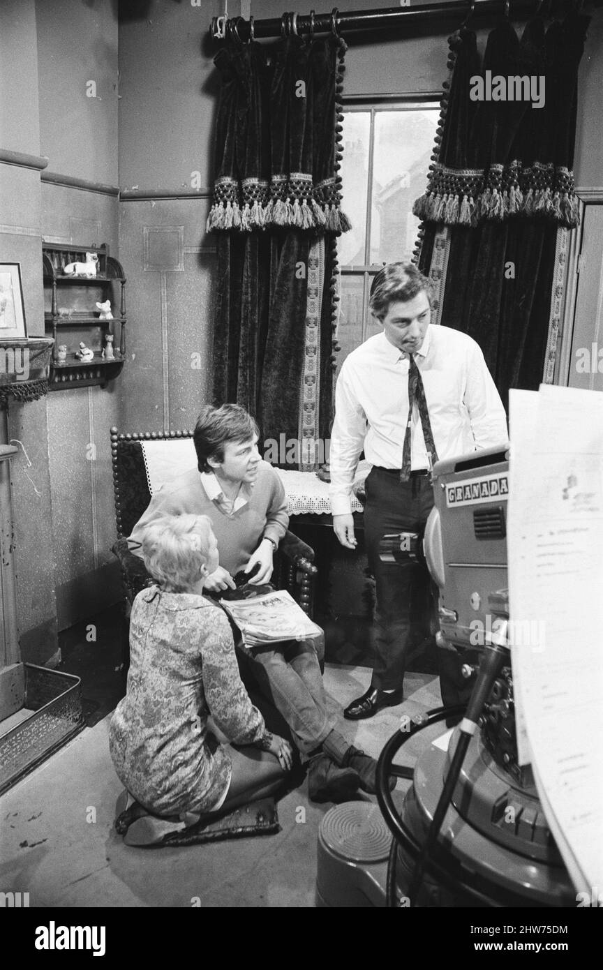 The cast of 'Coronation Street' on set. Tim Jones, Director, talks to ...