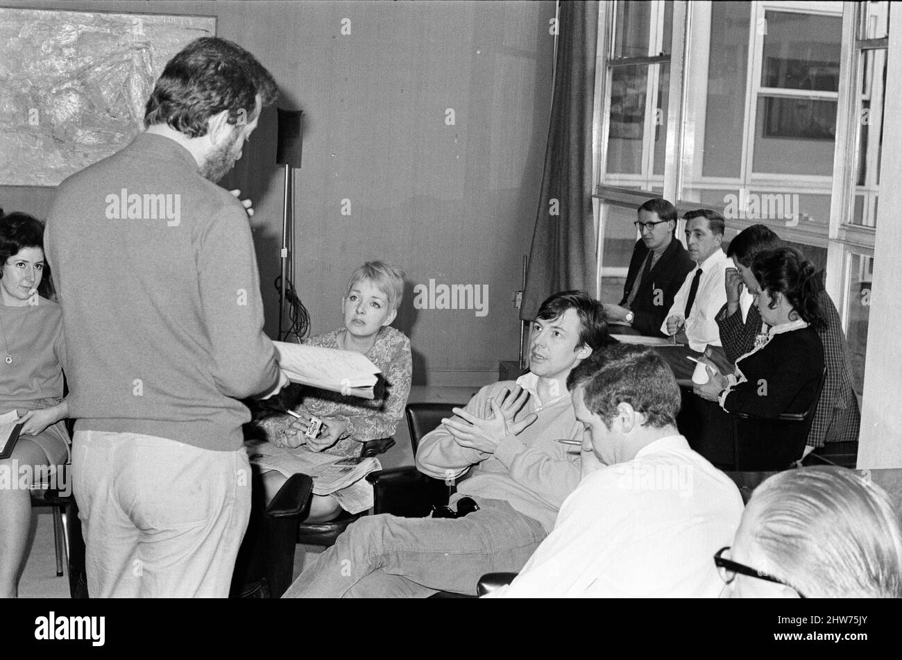 The cast of 'Coronation Street' on set. Tim Jones, director, speaks to ...