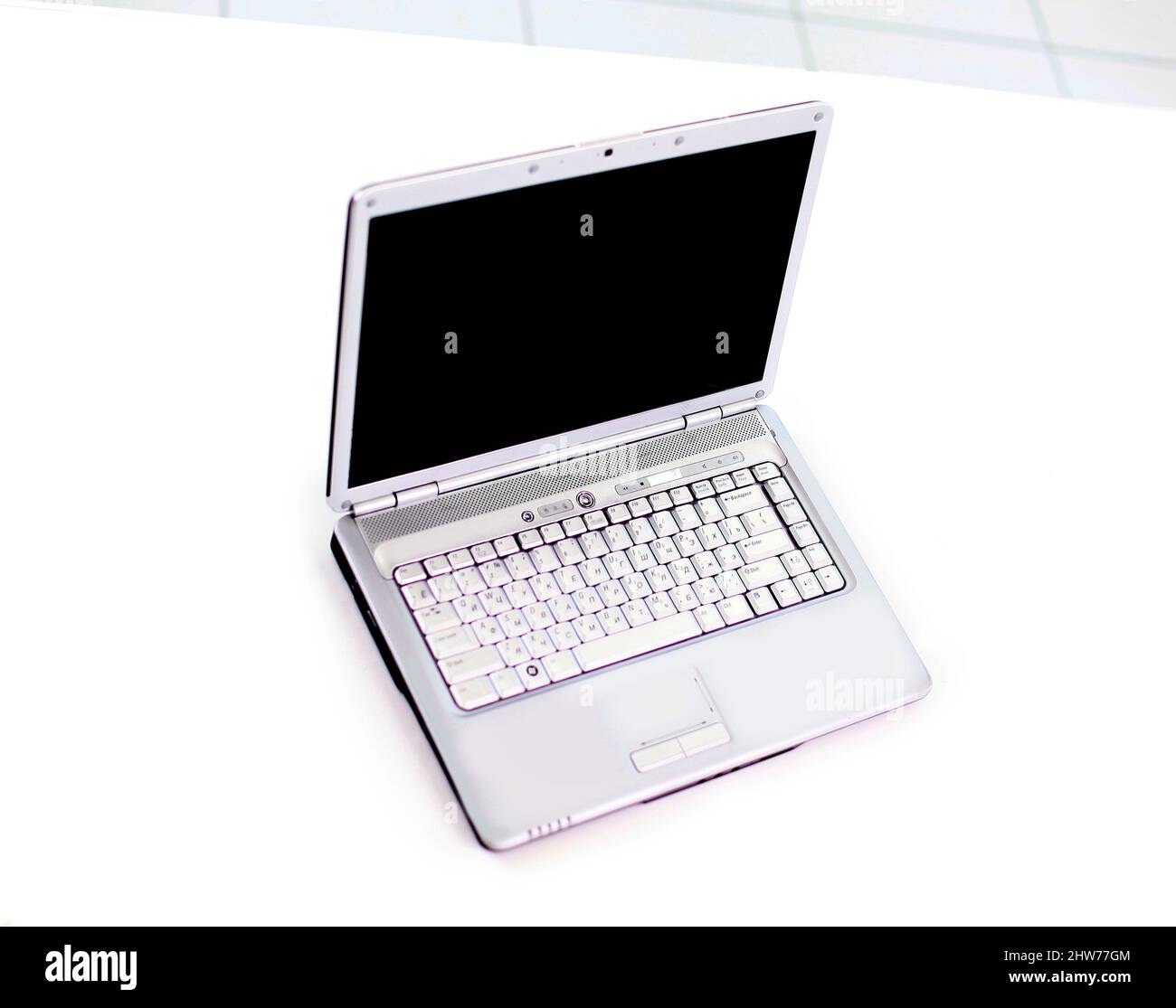 White laptop. Isolated on a white background Stock Photo - Alamy