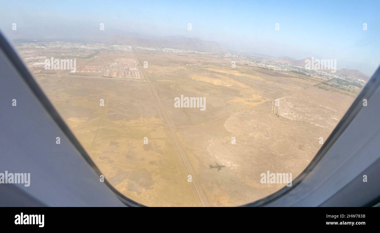 Aerial view of Santiago and the Andes mountains covered in smog and air ...