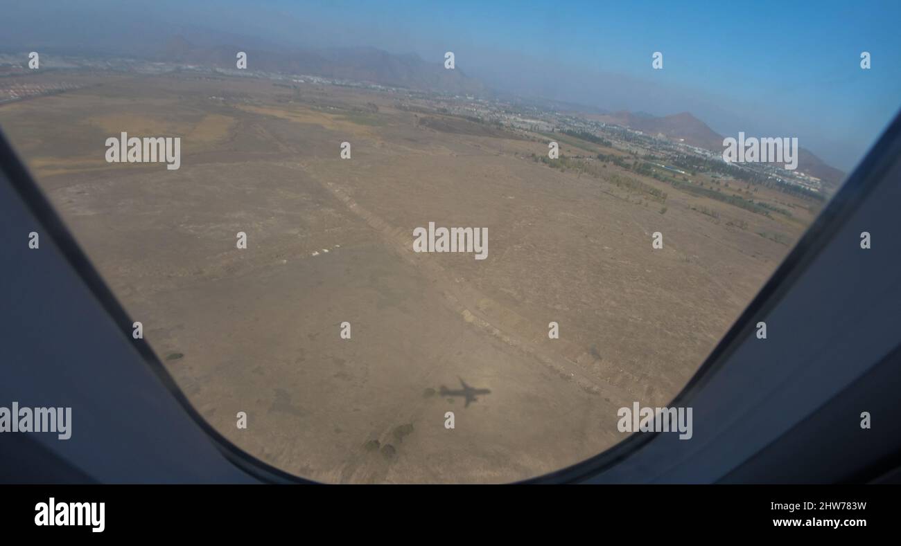 Aerial view of Santiago and the Andes mountains covered in smog and air ...