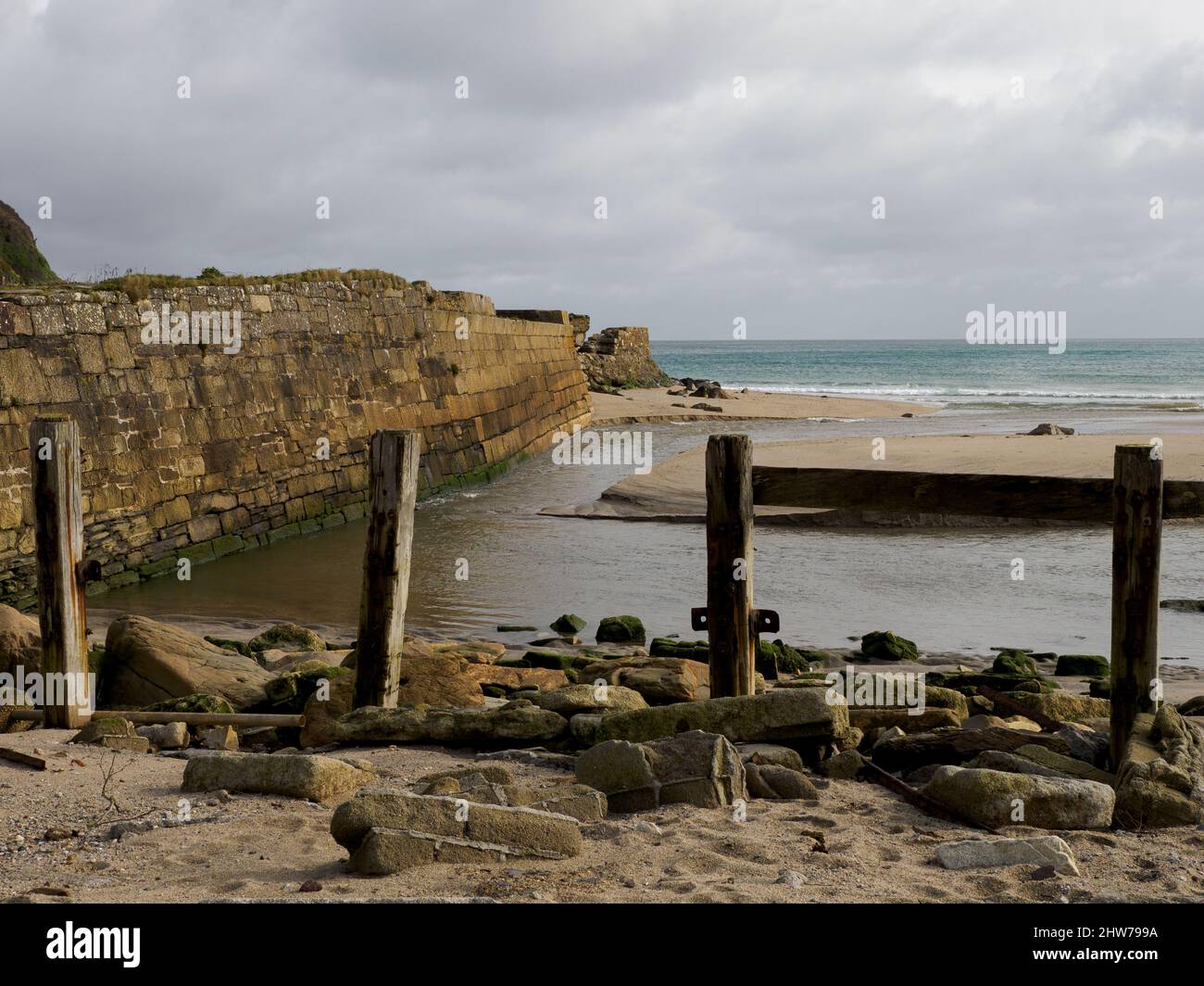 The remains of the pier wall part of the entrance to the harbour ...