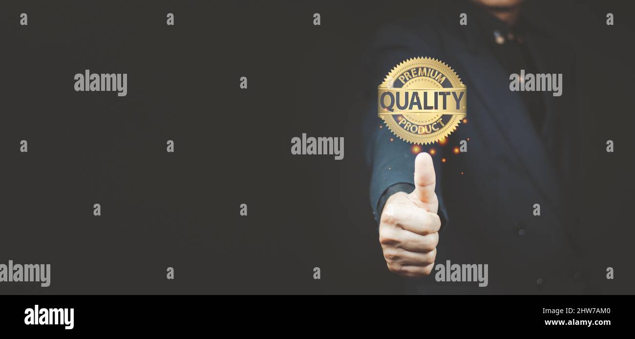 Quality product symbol in the hand of a business man.Hand shows the ...