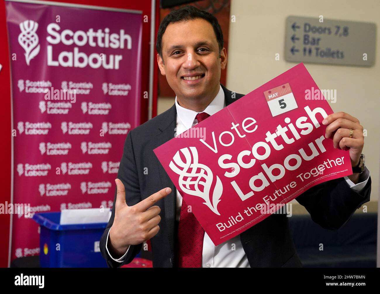 Scottish Labour leader Anas Sarwar holds a poster showing the new ...