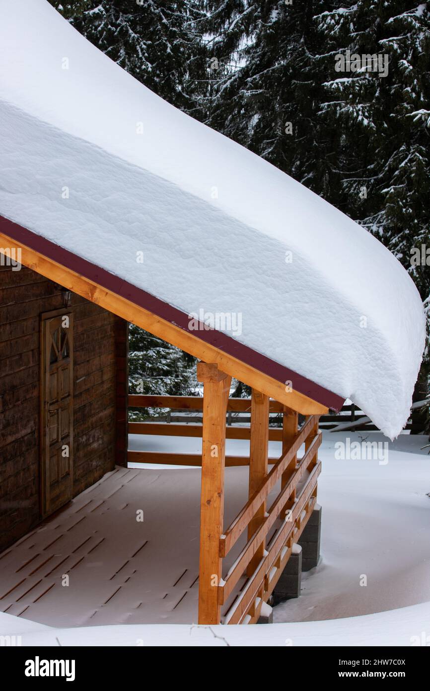 Vertical shot of deep snow on the roof of a wooden terrace Stock Photo ...