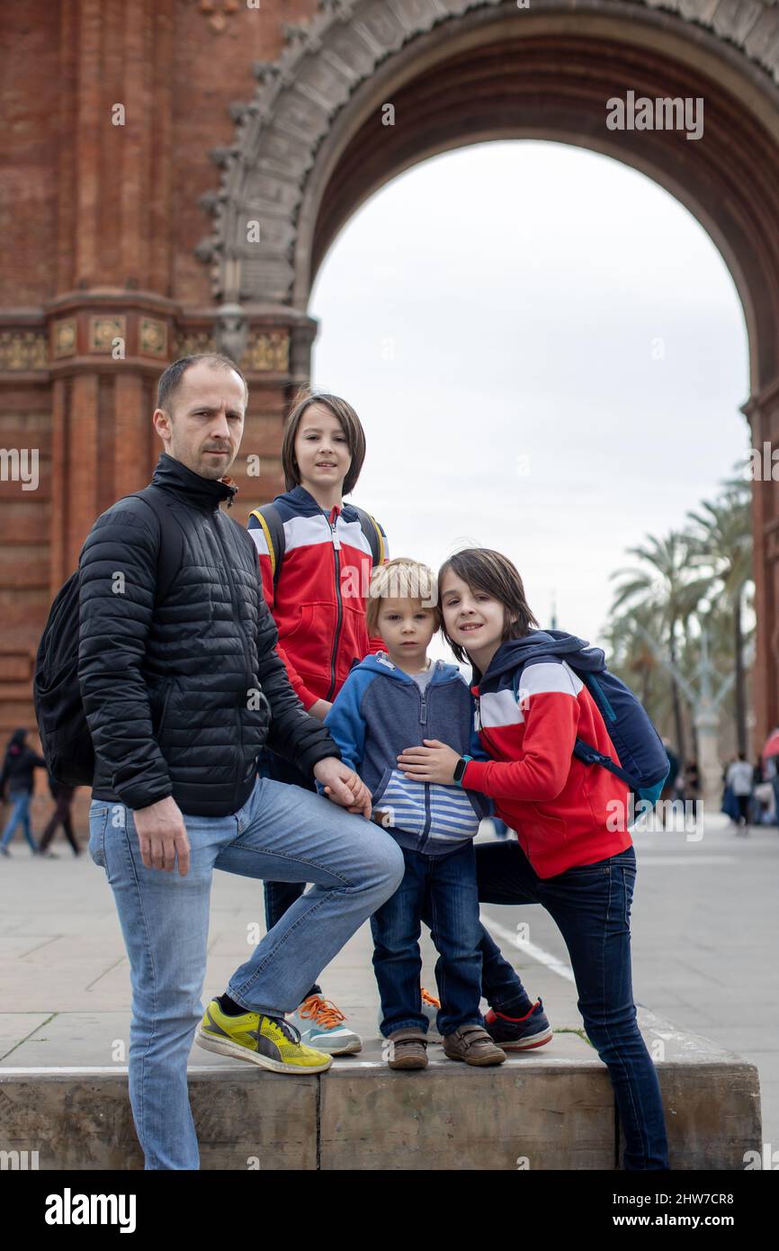 Cute little children tourists admiring Barcelona city, standing in ...